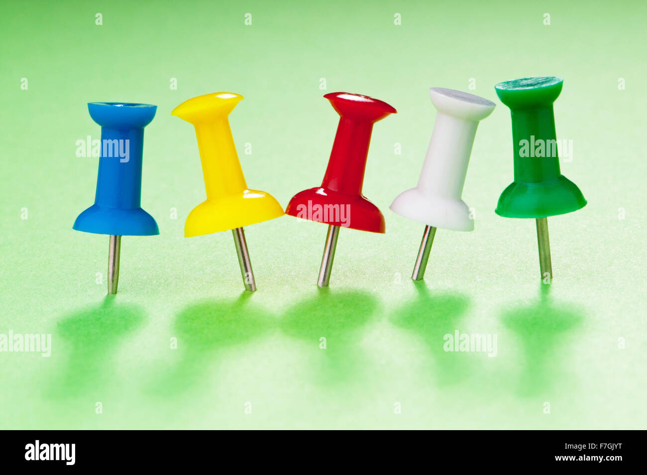 Office pins on the paper Stock Photo - Alamy