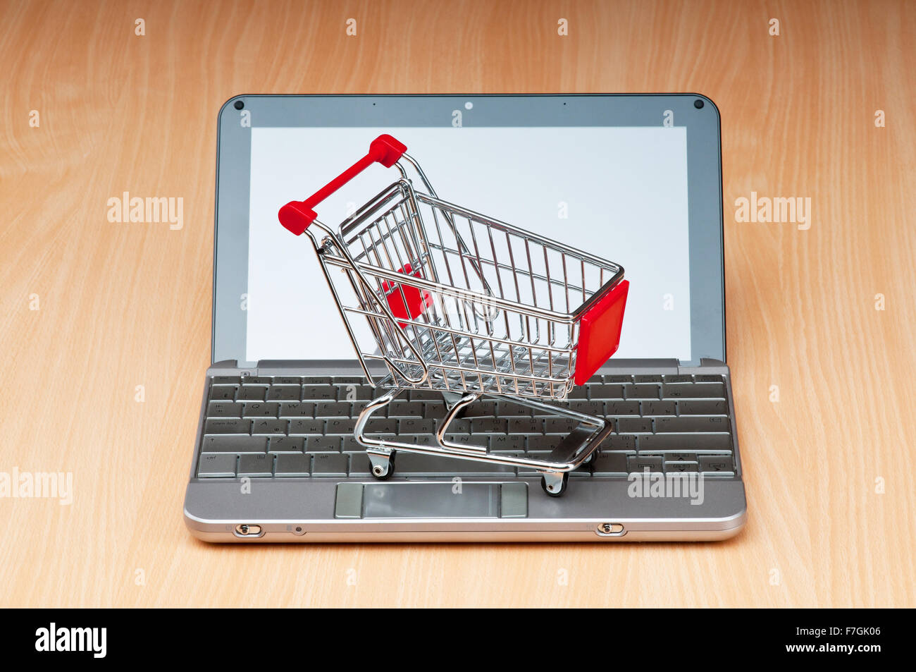 Internet online shopping concept with computer and cart Stock Photo - Alamy