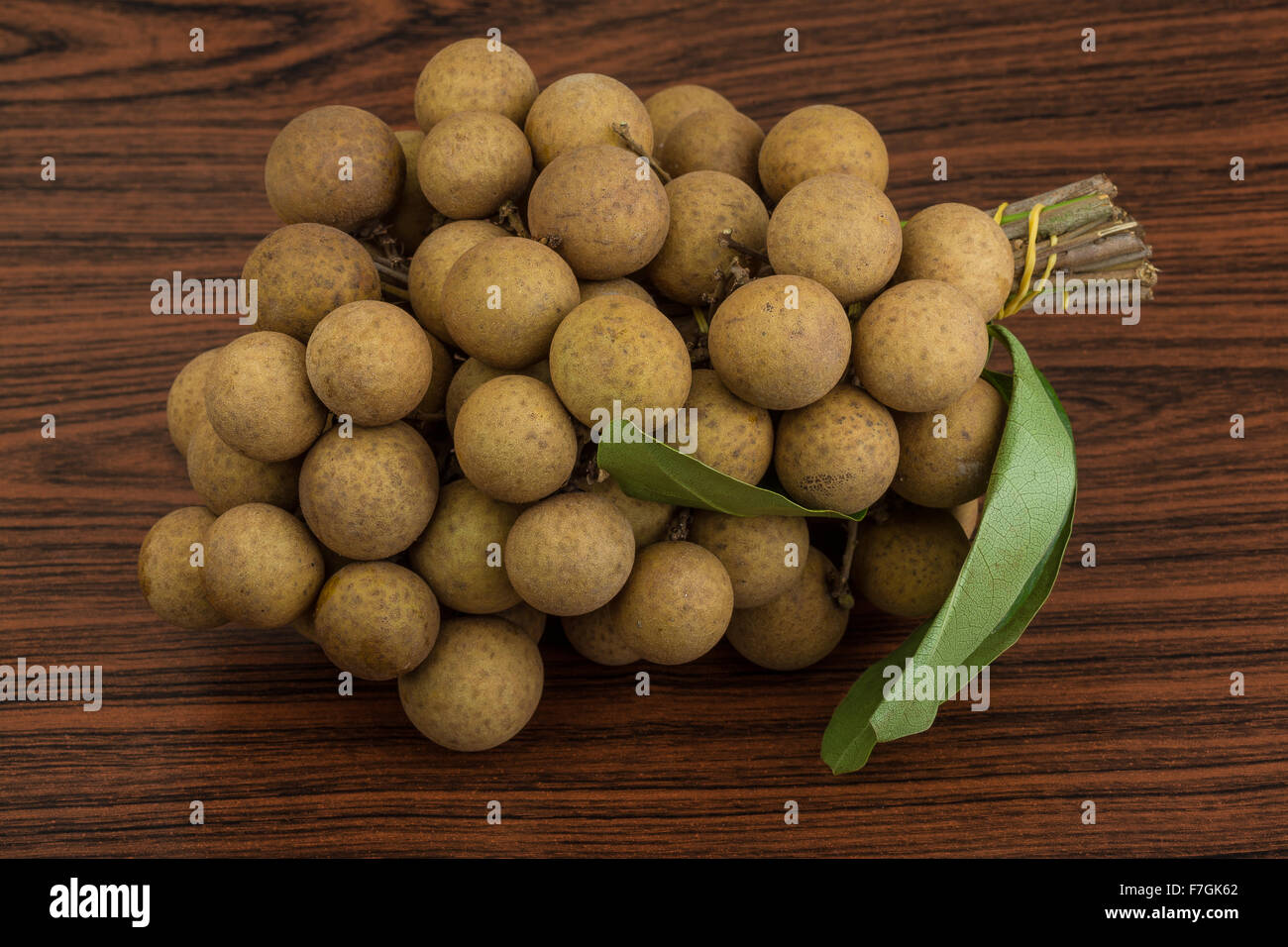 Asian fruit Longan - on wood background Stock Photo - Alamy