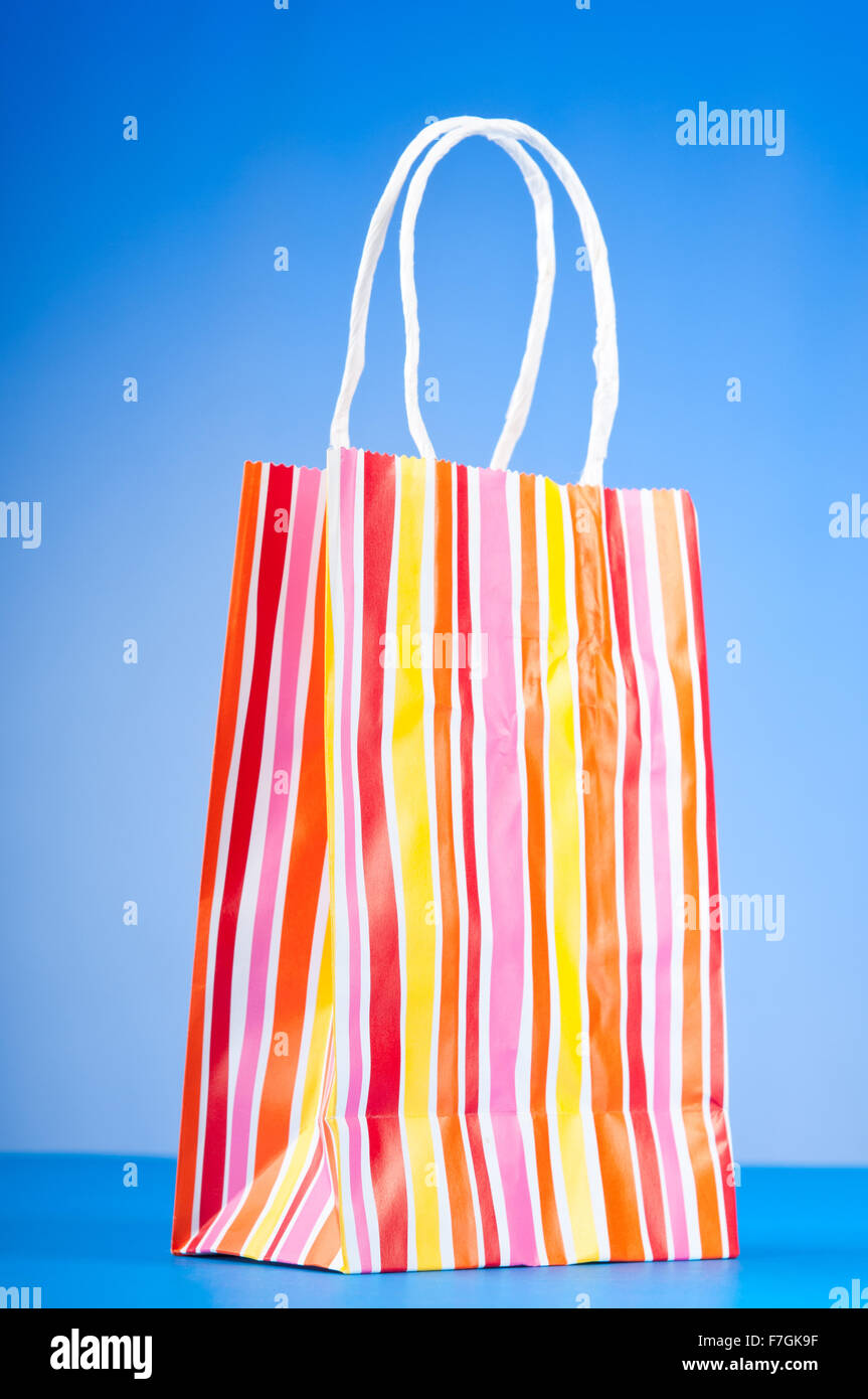 Colourful paper shopping bags against gradient background Stock Photo ...