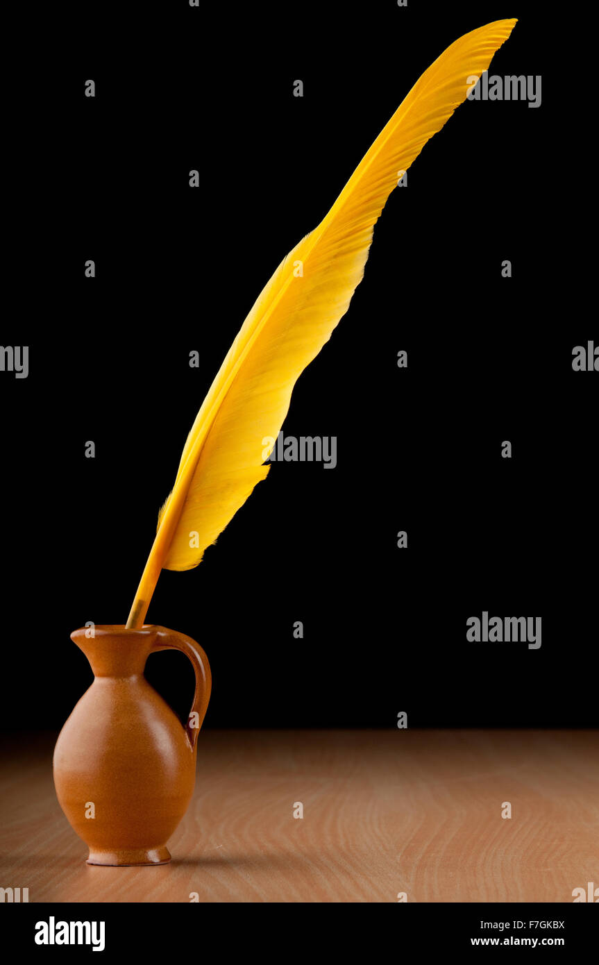 Writing feather against gradient background Stock Photo - Alamy