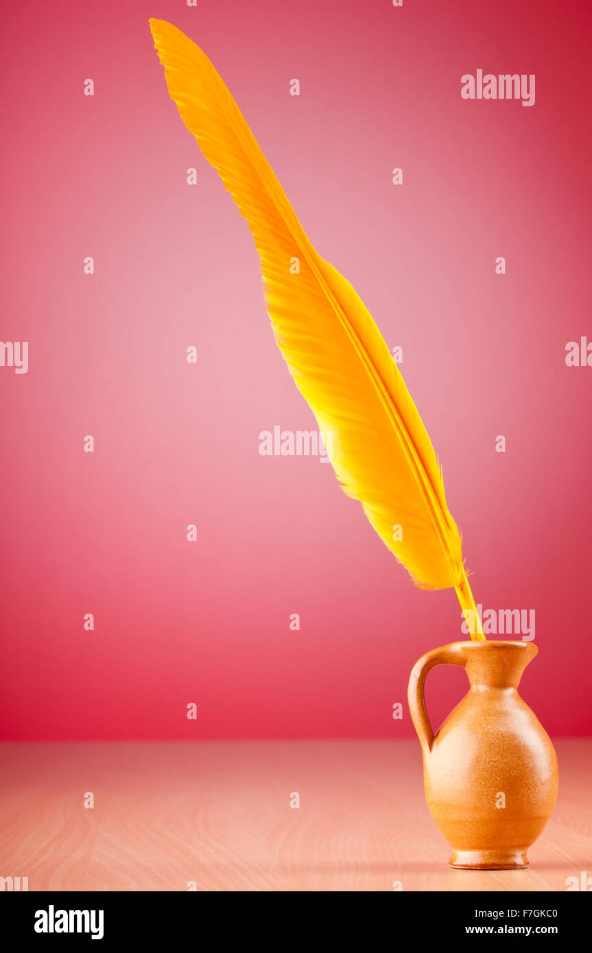Writing feather against gradient background Stock Photo - Alamy