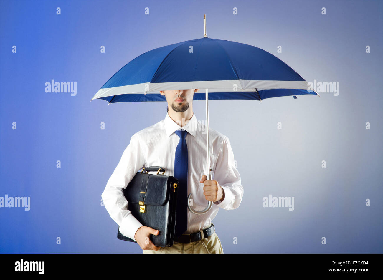Young businessman holding shield hi-res stock photography and images ...