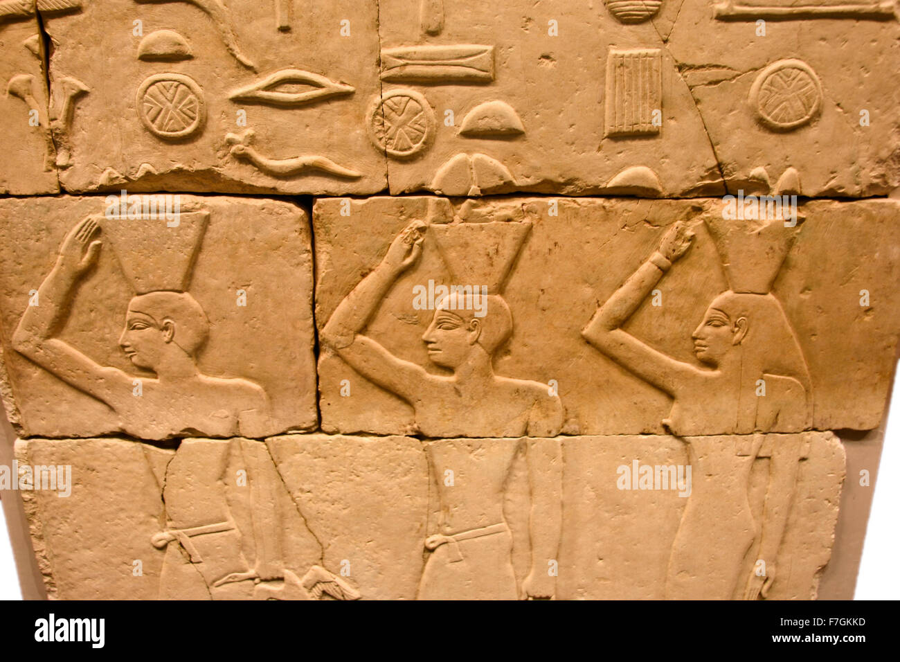 Egyptian relief with three offering people. They transport goods on ...