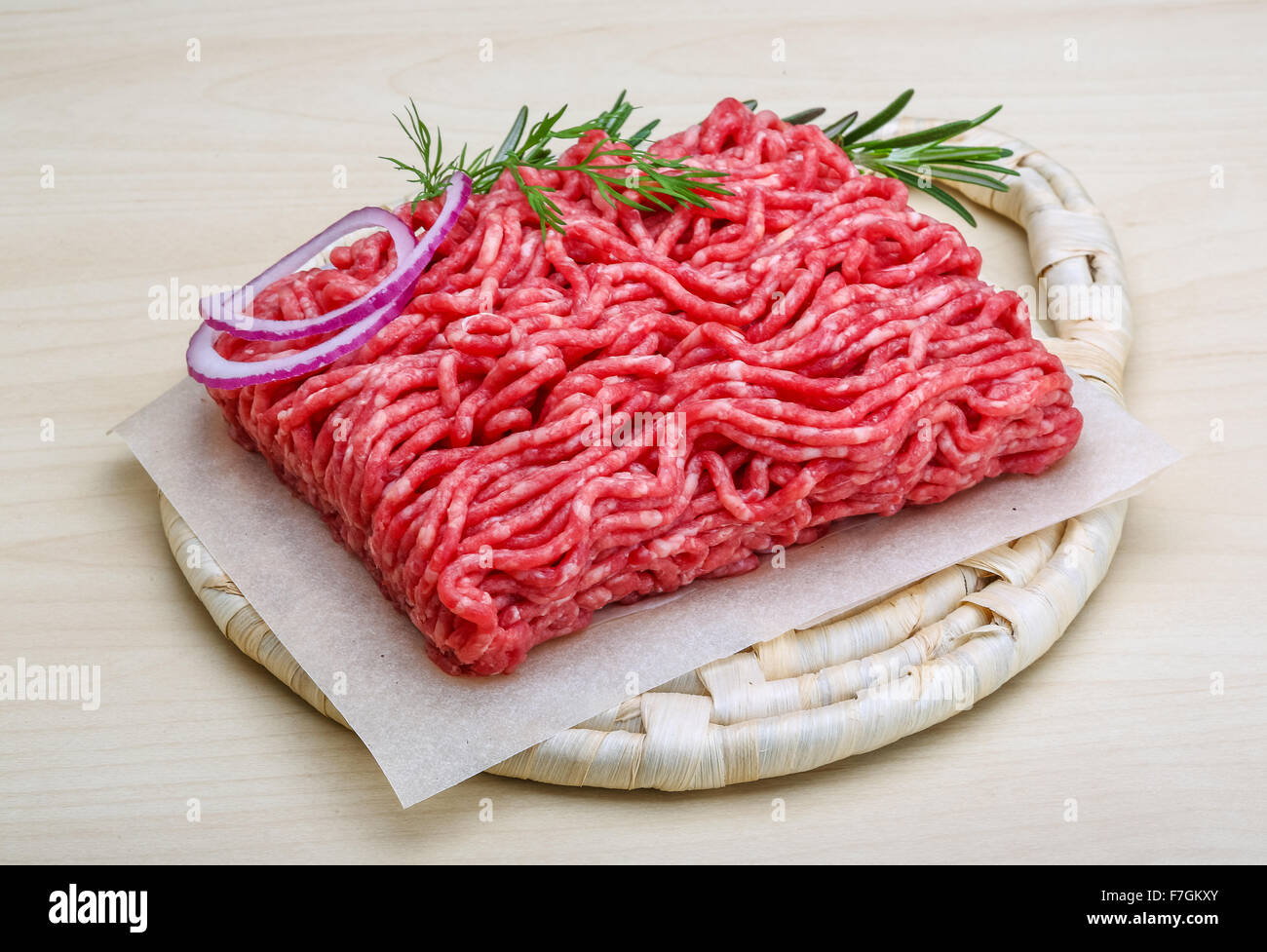 Raw beef minced meat with rosemary and onion Stock Photo - Alamy