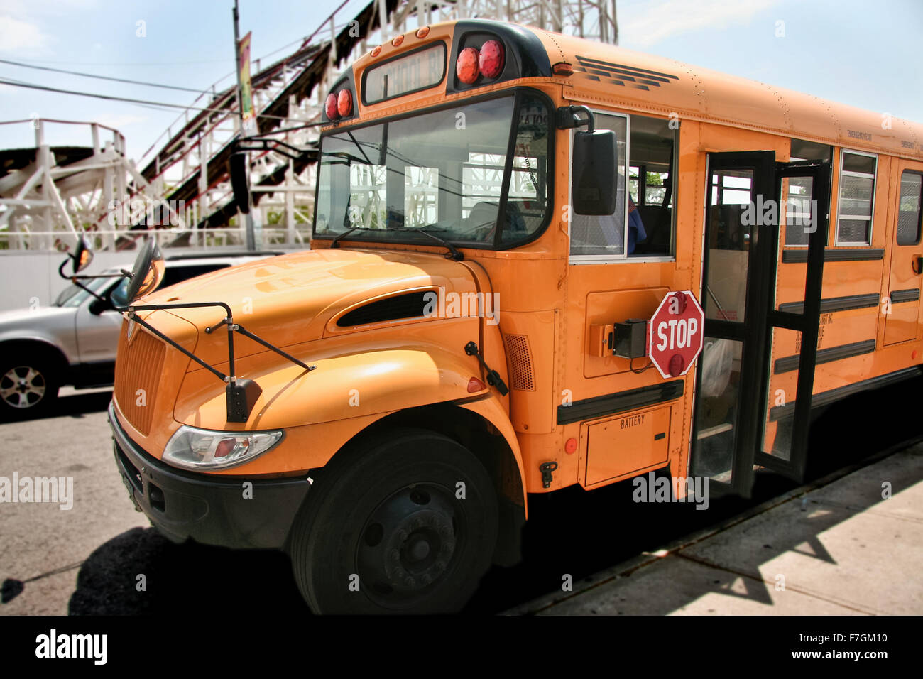School bus parked while the kids visit the theme park of Coney Island ...