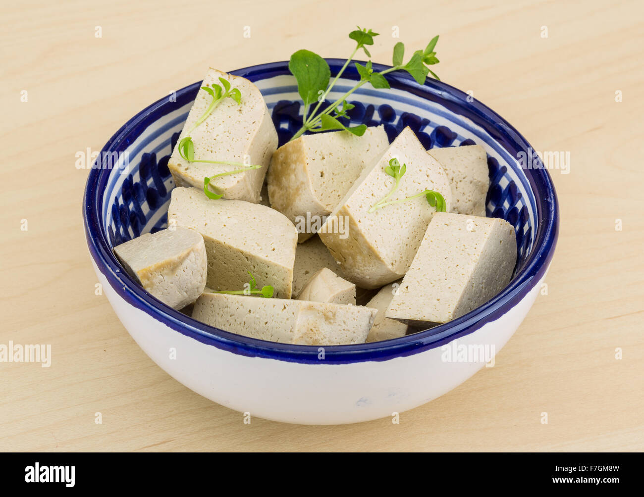 Tofu - soya cheese with herbs on the wood background Stock Photo - Alamy