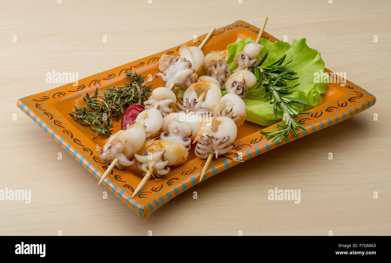 Grilled cuttlefish bbq with rosemary and pepper Stock Photo - Alamy