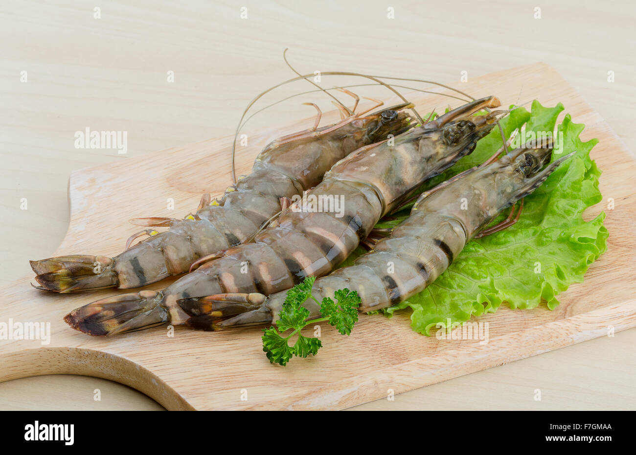 Raw tiger shrimps on the wood board Stock Photo - Alamy