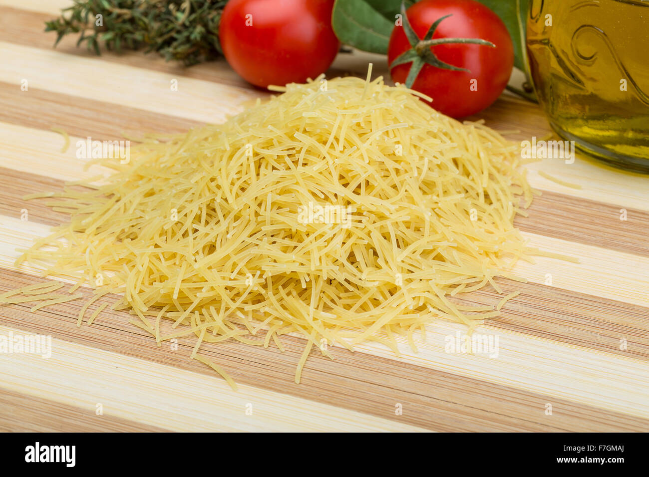 Raw Italian pasta vermicelli on the wood background Stock Photo - Alamy