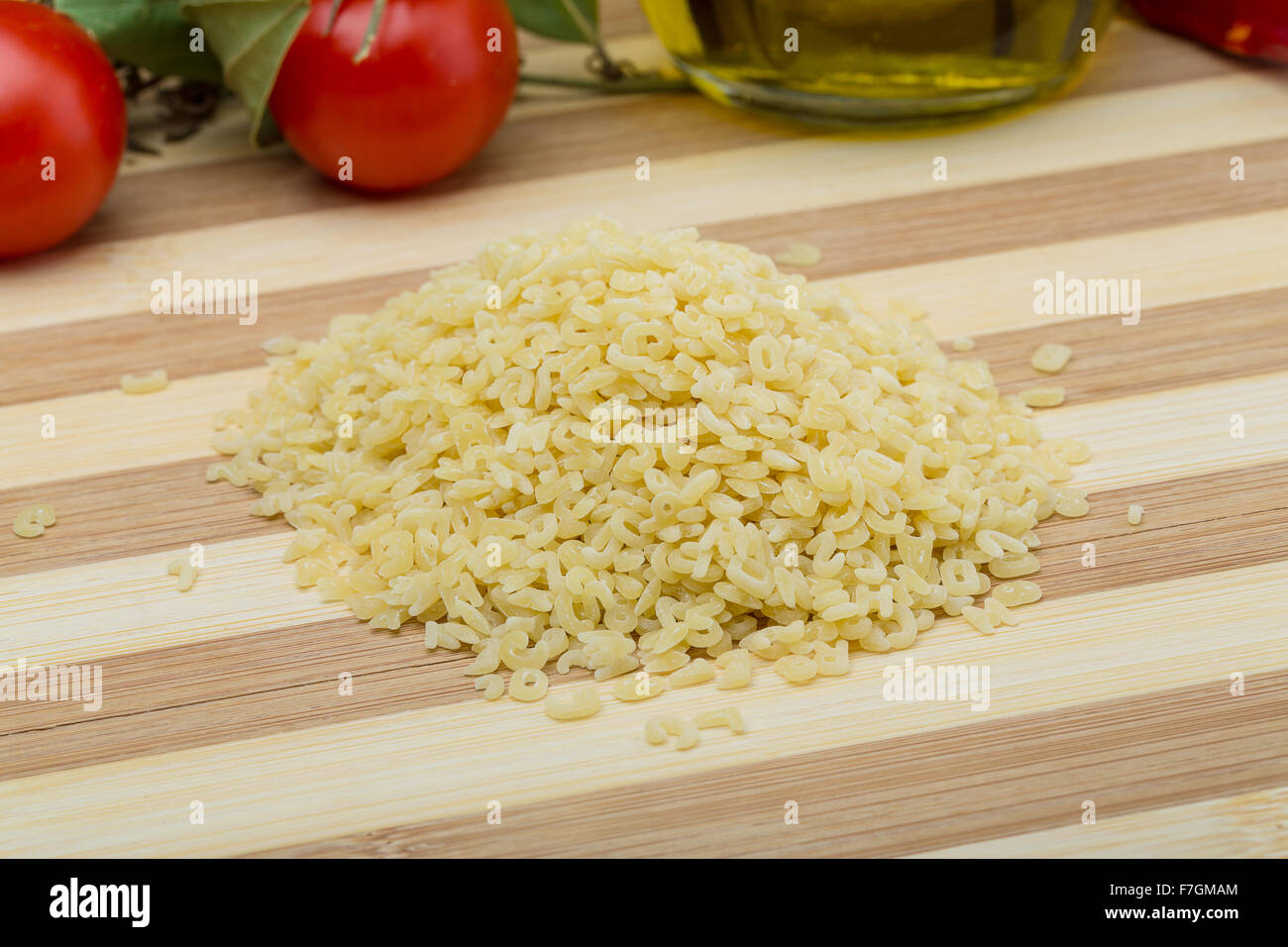 Raw ABC macaroni on the wood background Stock Photo - Alamy