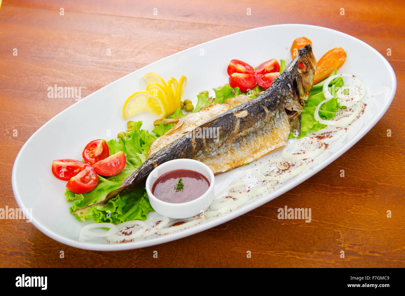 Fried fish in the plate Stock Photo - Alamy