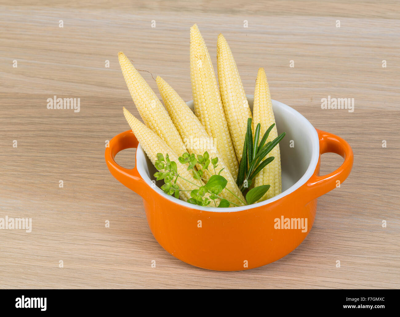 Fresh ripe Baby corn on the wood background Stock Photo - Alamy