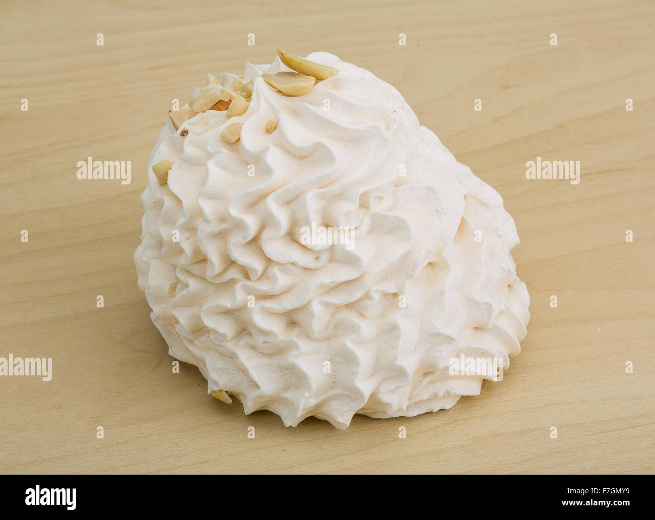 White meringue with nut on the wood background Stock Photo - Alamy