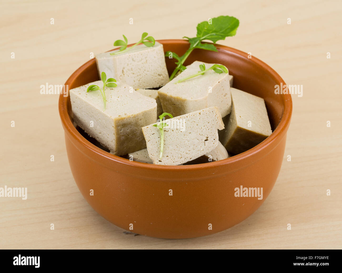 Tofu - soya cheese with herbs on the wood background Stock Photo - Alamy