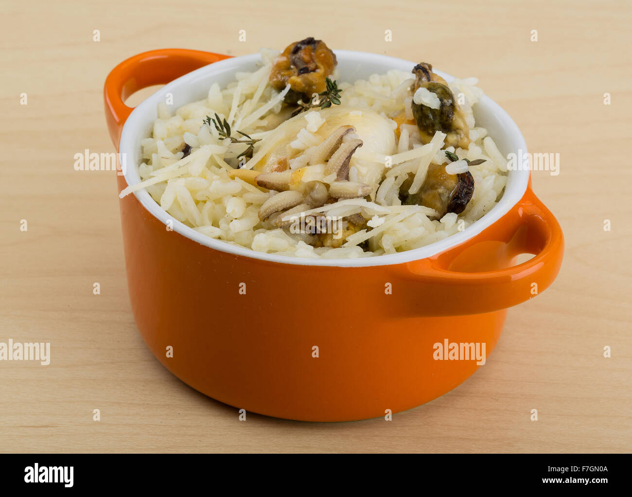 Risotto with mussels and cuttlefish served fresh thyme Stock Photo - Alamy