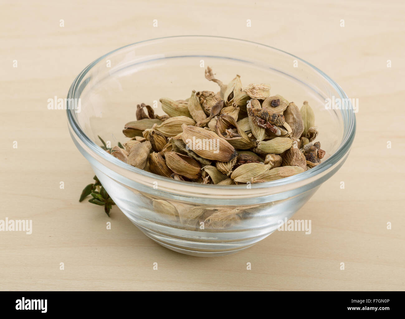 Dry Cardamom heap on the wood background Stock Photo - Alamy
