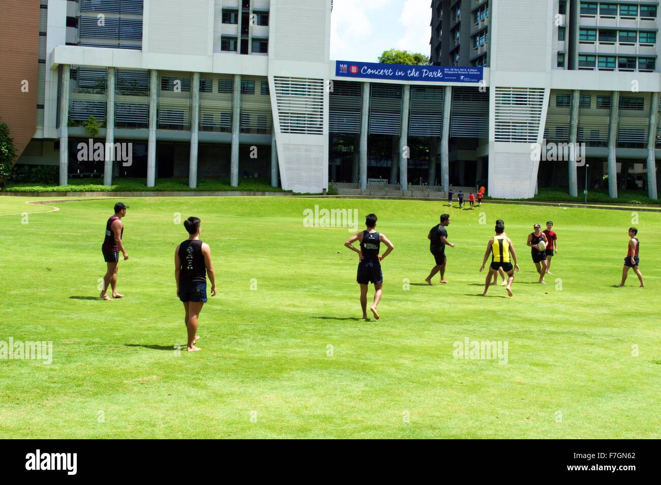 A group of students are playing in a university campus field Stock ...