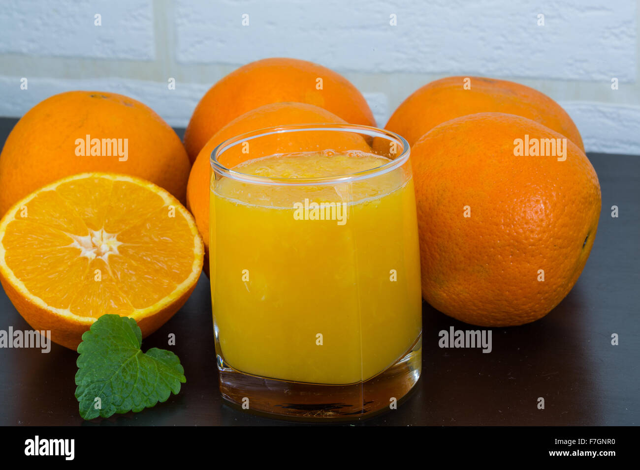Fresh made Orange juice with ripe fruits Stock Photo - Alamy