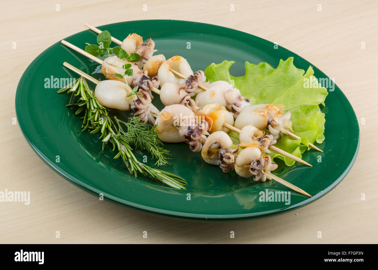 Grilled cuttlefish bbq with rosemary and pepper Stock Photo - Alamy