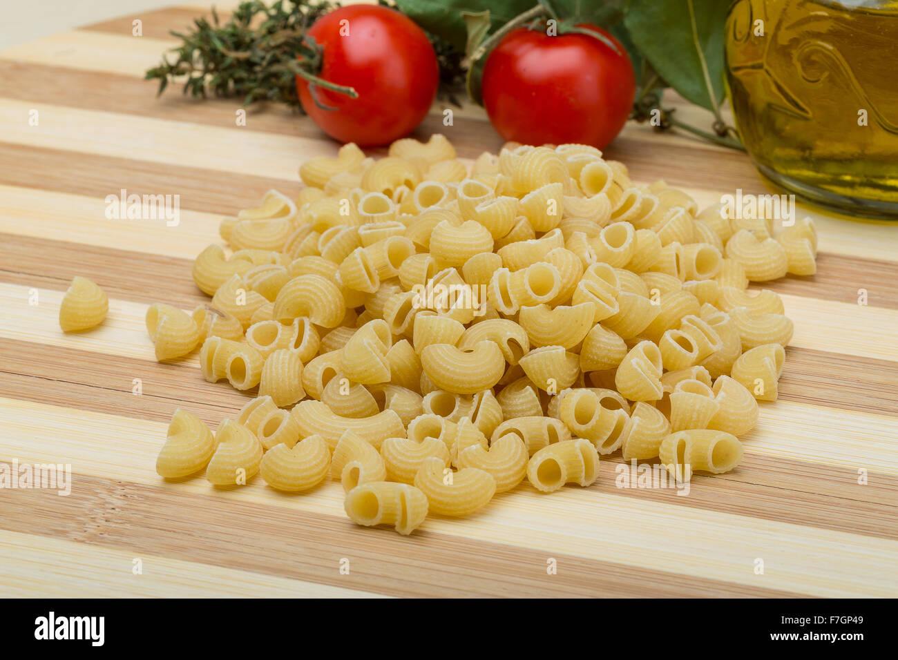 Pipe rigate pasta on the wood background Stock Photo - Alamy