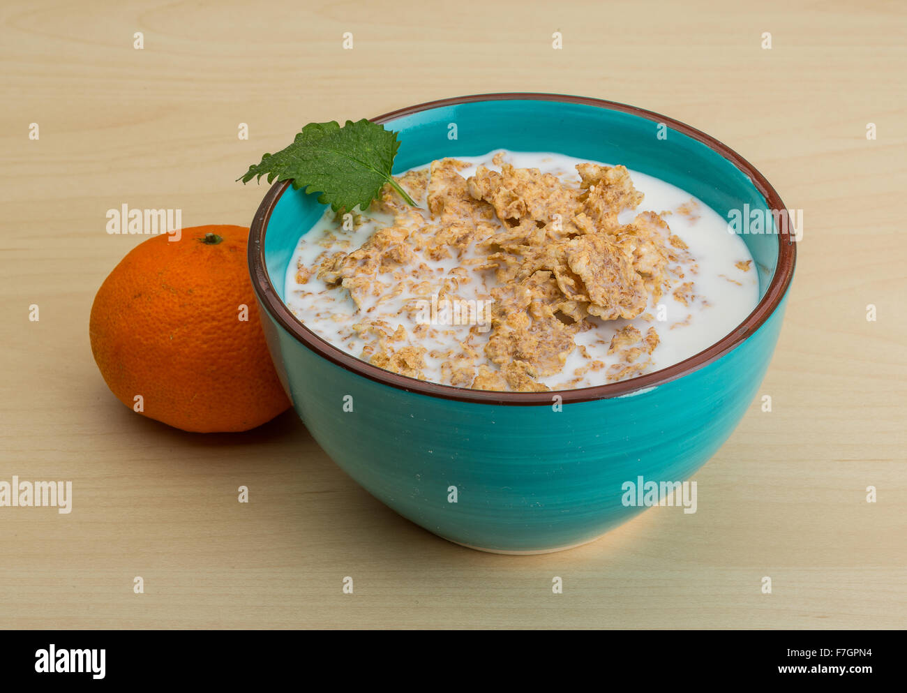 Cornflakes with tangerine and fresh mint leaves Stock Photo - Alamy