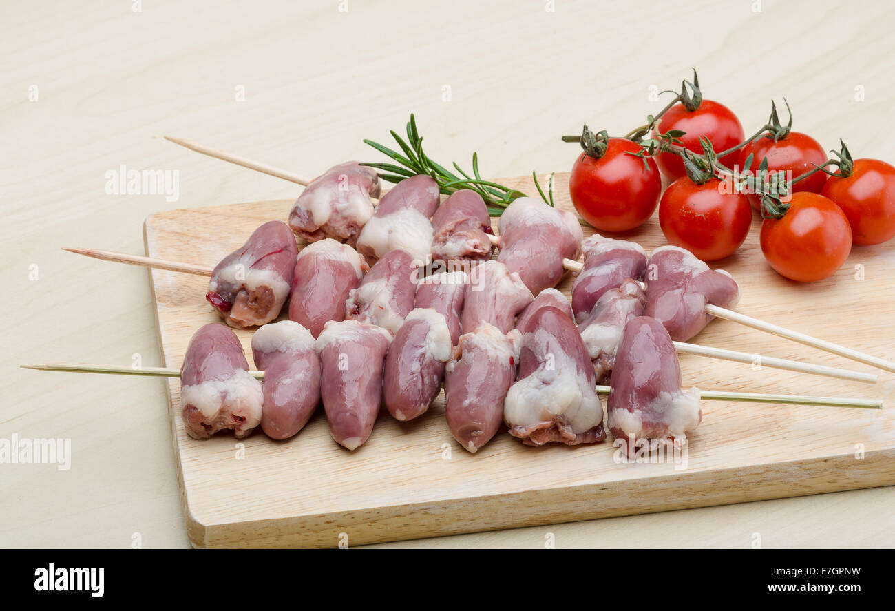 Raw chicken hearts ready for barbecue with rosemary Stock Photo - Alamy