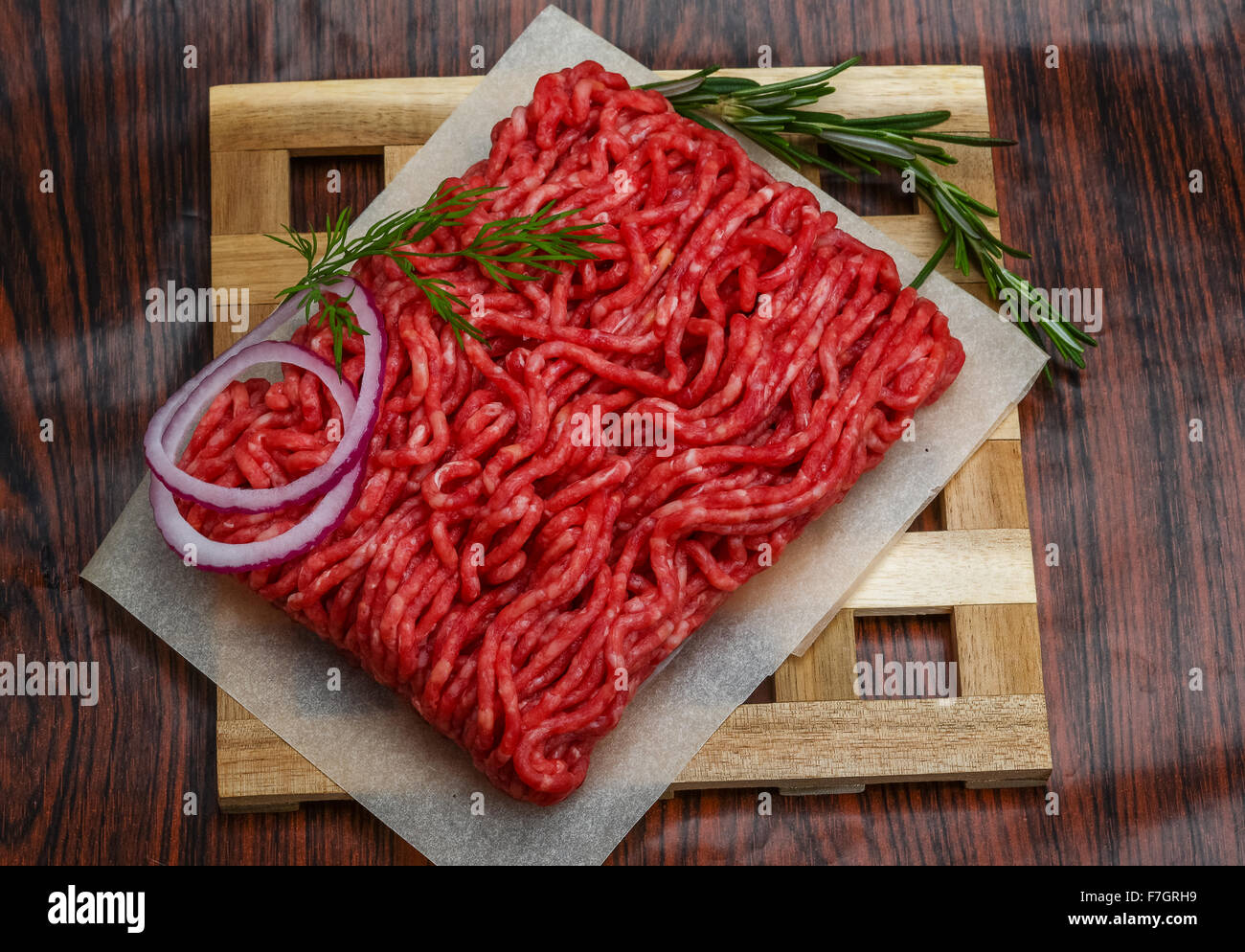 Raw beef minced meat with rosemary and onion Stock Photo - Alamy