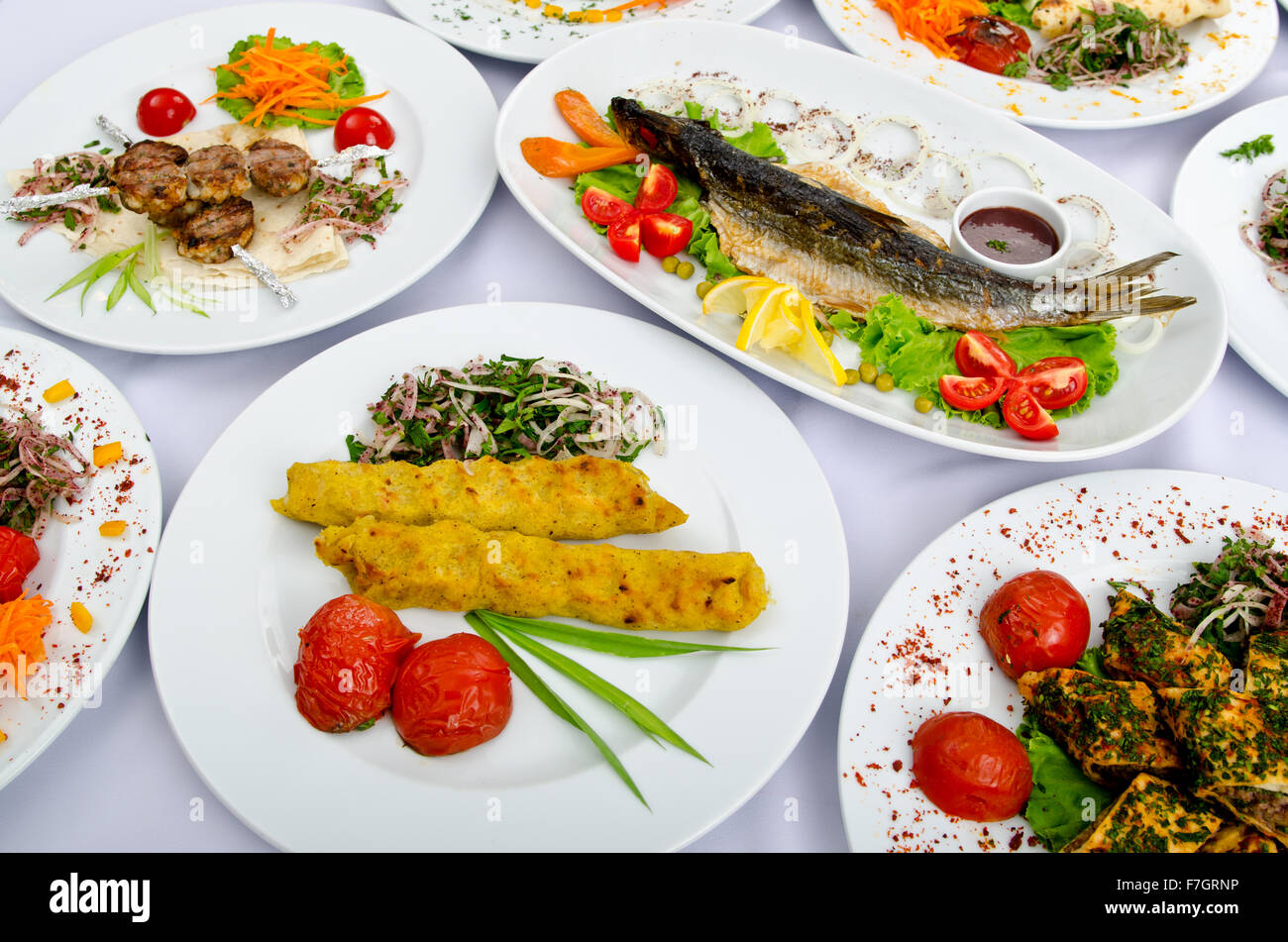 Lots of meals served on table Stock Photo - Alamy