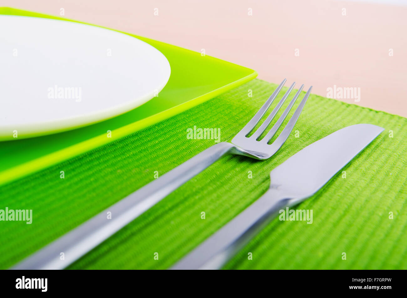 Empty plate with utensils Stock Photo - Alamy