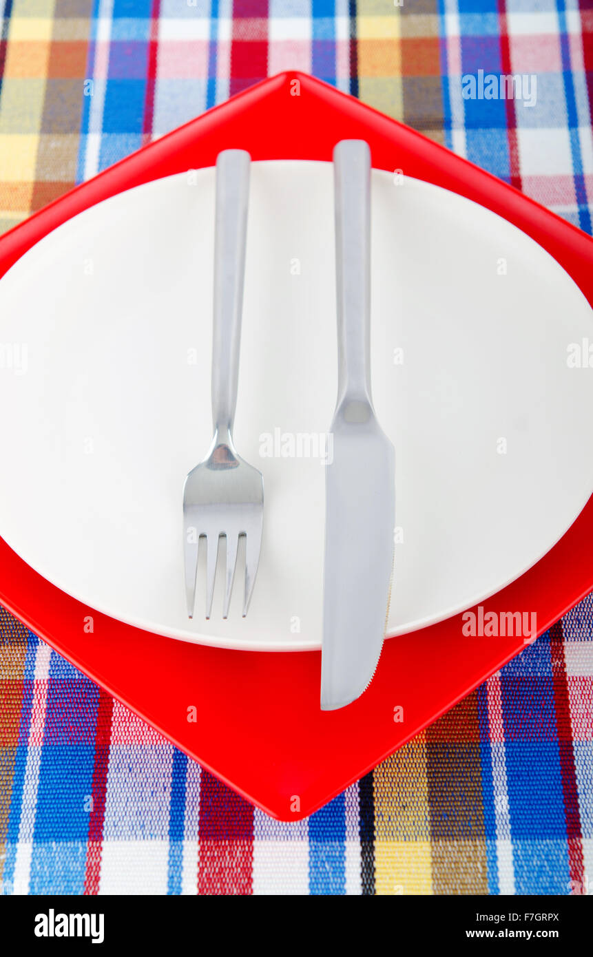 Empty plate with utensils Stock Photo - Alamy