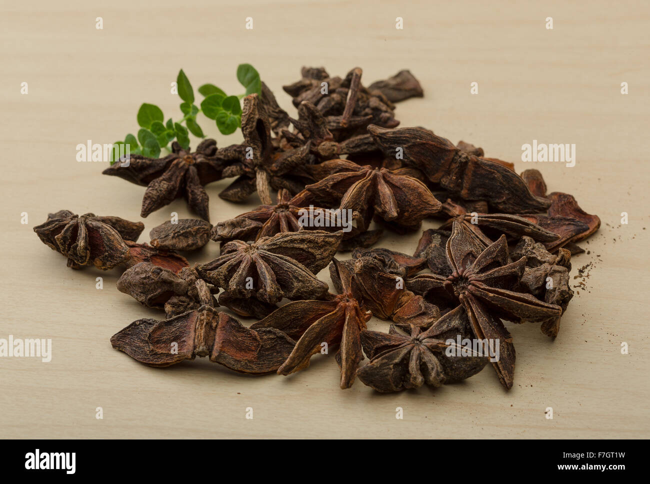 Star-anise heap on the wood background Stock Photo - Alamy