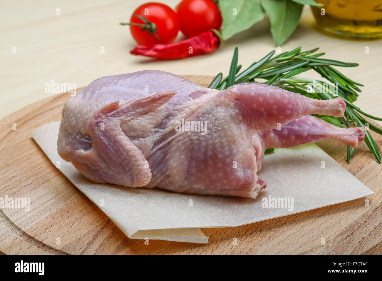Raw quail with herbs ready for cooking Stock Photo - Alamy