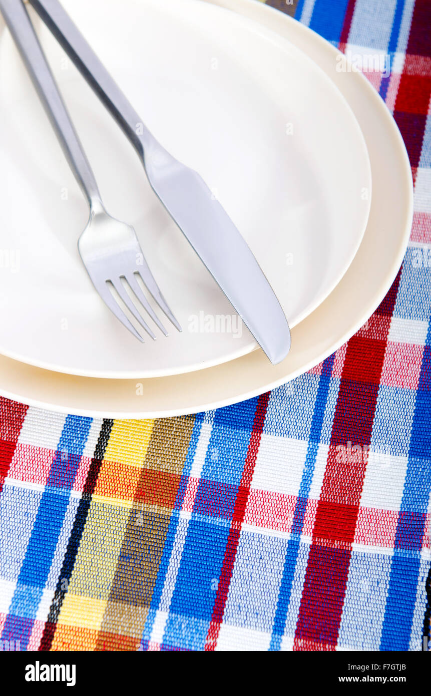 Empty plate with utensils Stock Photo - Alamy