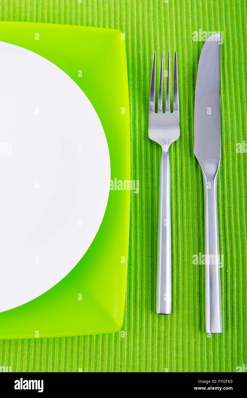 Empty plate with utensils Stock Photo - Alamy