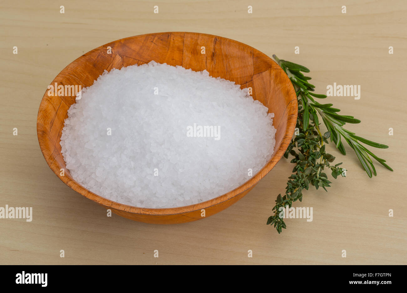 Sea salt heap crystal with thyme branch Stock Photo - Alamy