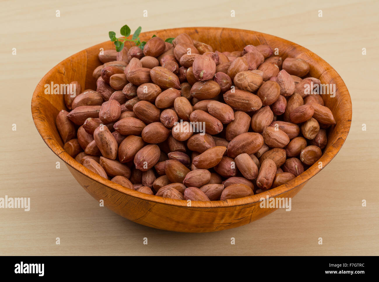 Raw Peanut in the bowl on wood background Stock Photo - Alamy