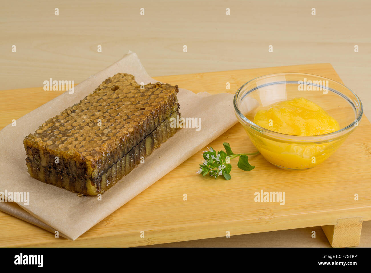 Honey with comb on the wooden background Stock Photo - Alamy