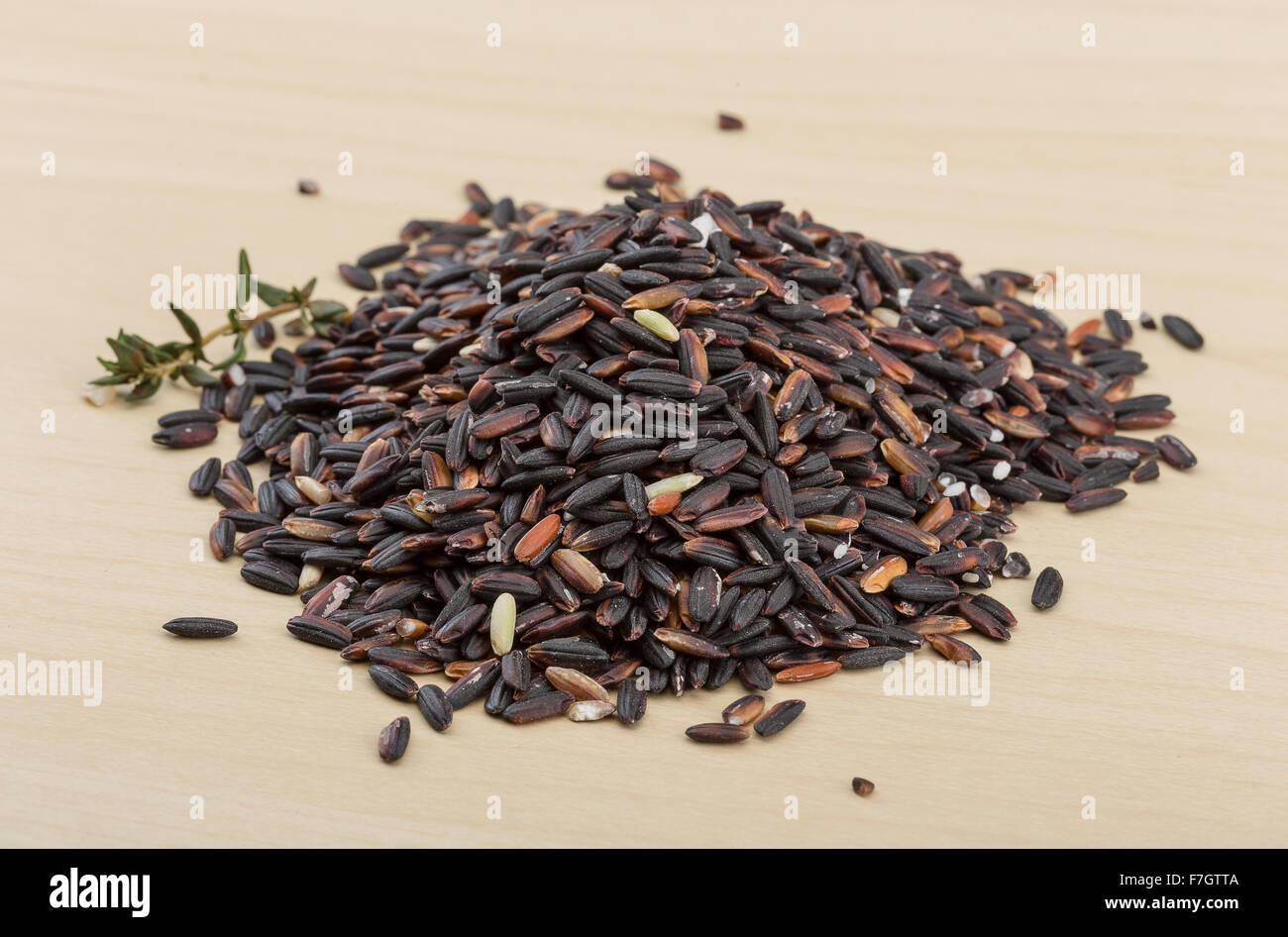 Dry wild rice mix heap on the wood background Stock Photo - Alamy