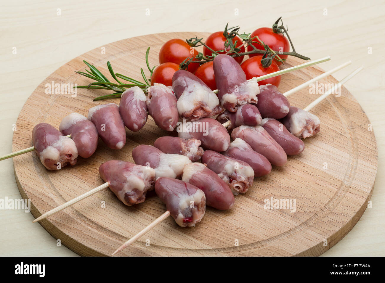 Raw chicken hearts ready for barbecue with rosemary Stock Photo - Alamy