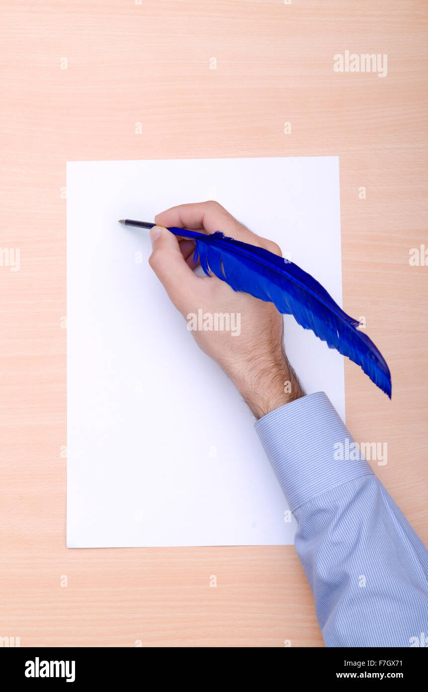 Man with quill writing Stock Photo - Alamy