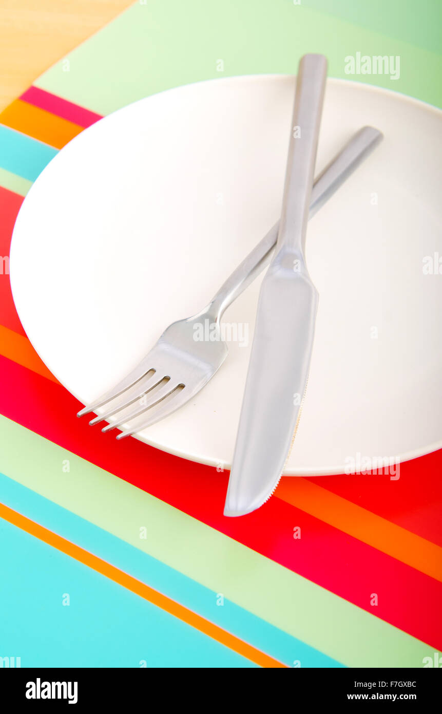 Empty plate with utensils Stock Photo - Alamy