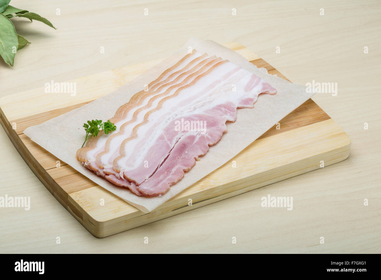 Raw Bacon strips on the wood background Stock Photo - Alamy