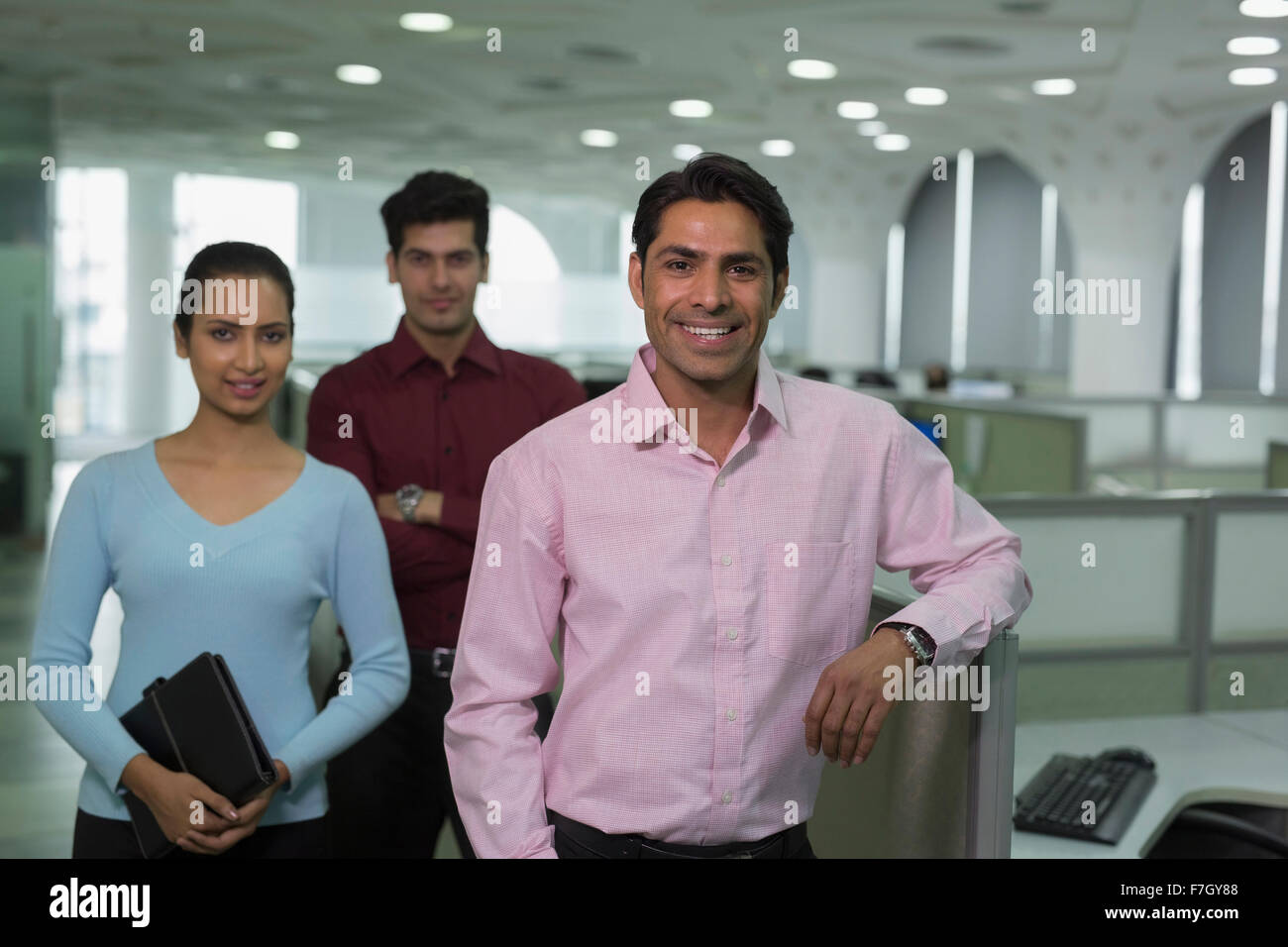 India, Smiling office workers looking at camera Stock Photo - Alamy