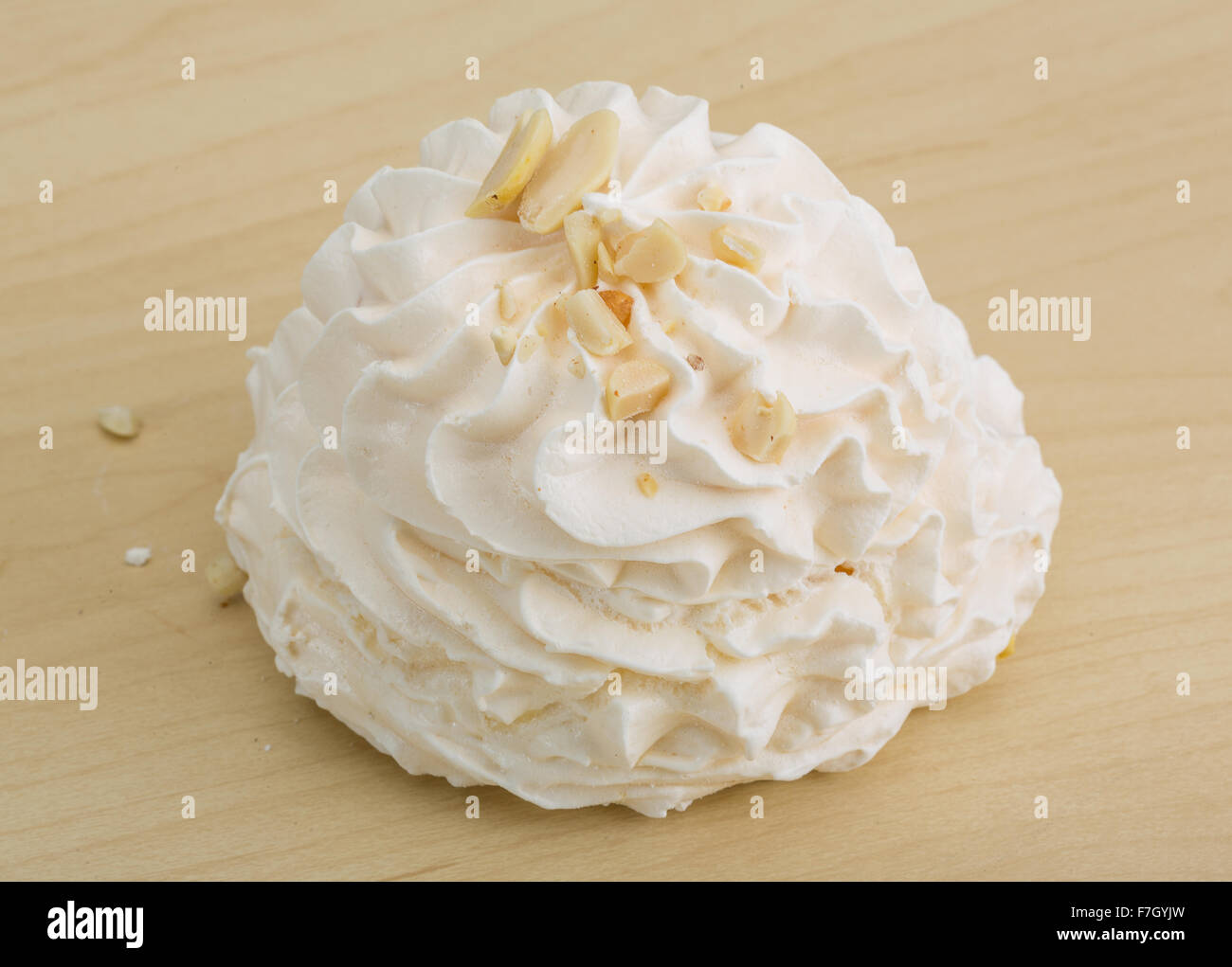 White meringue with nut on the wood background Stock Photo - Alamy