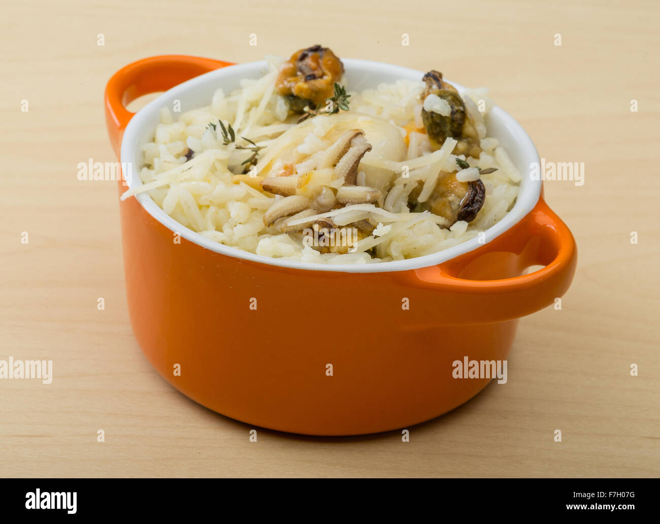 Risotto with mussels and cuttlefish served fresh thyme Stock Photo - Alamy