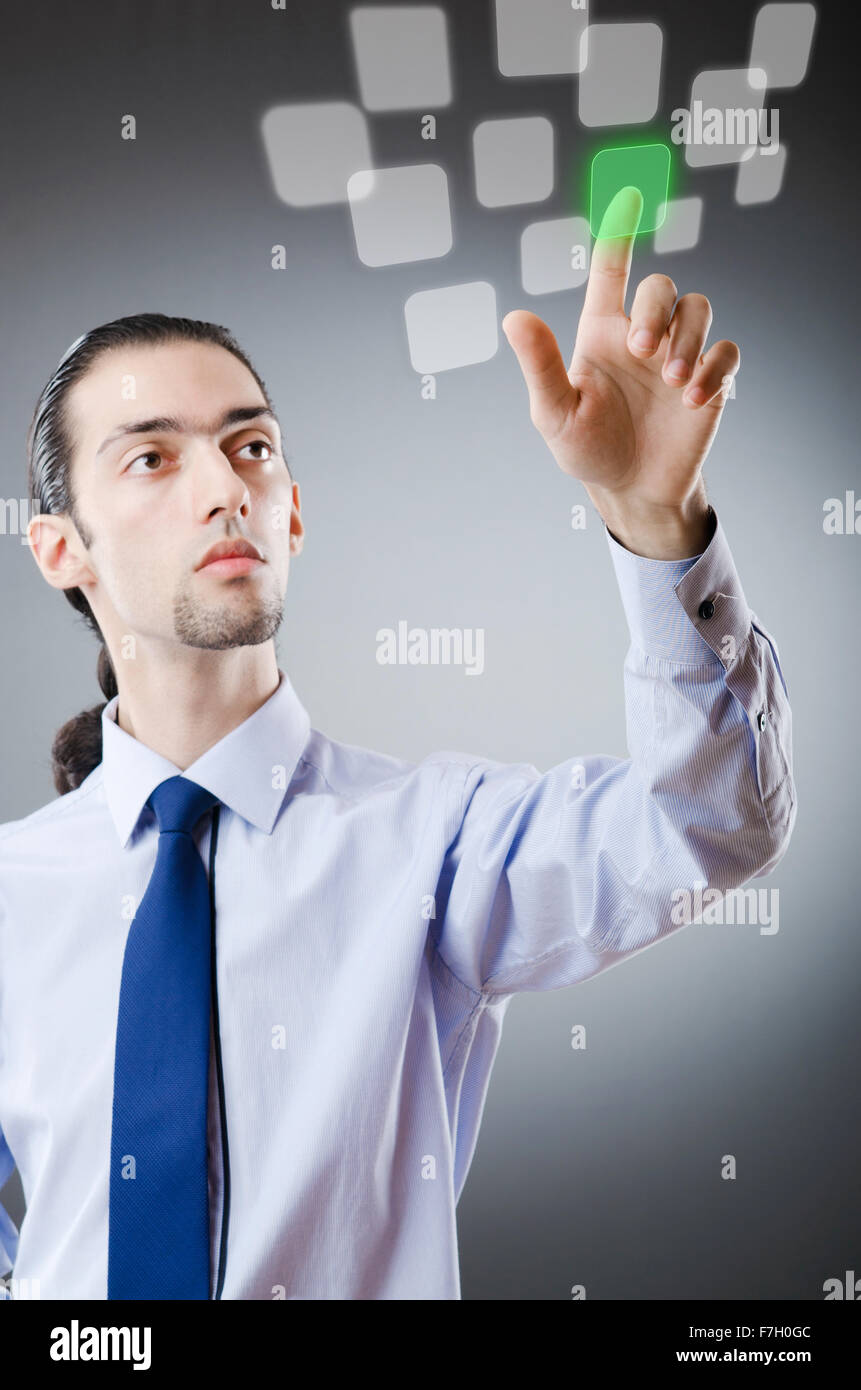 Businessman pressing virtual buttons Stock Photo - Alamy