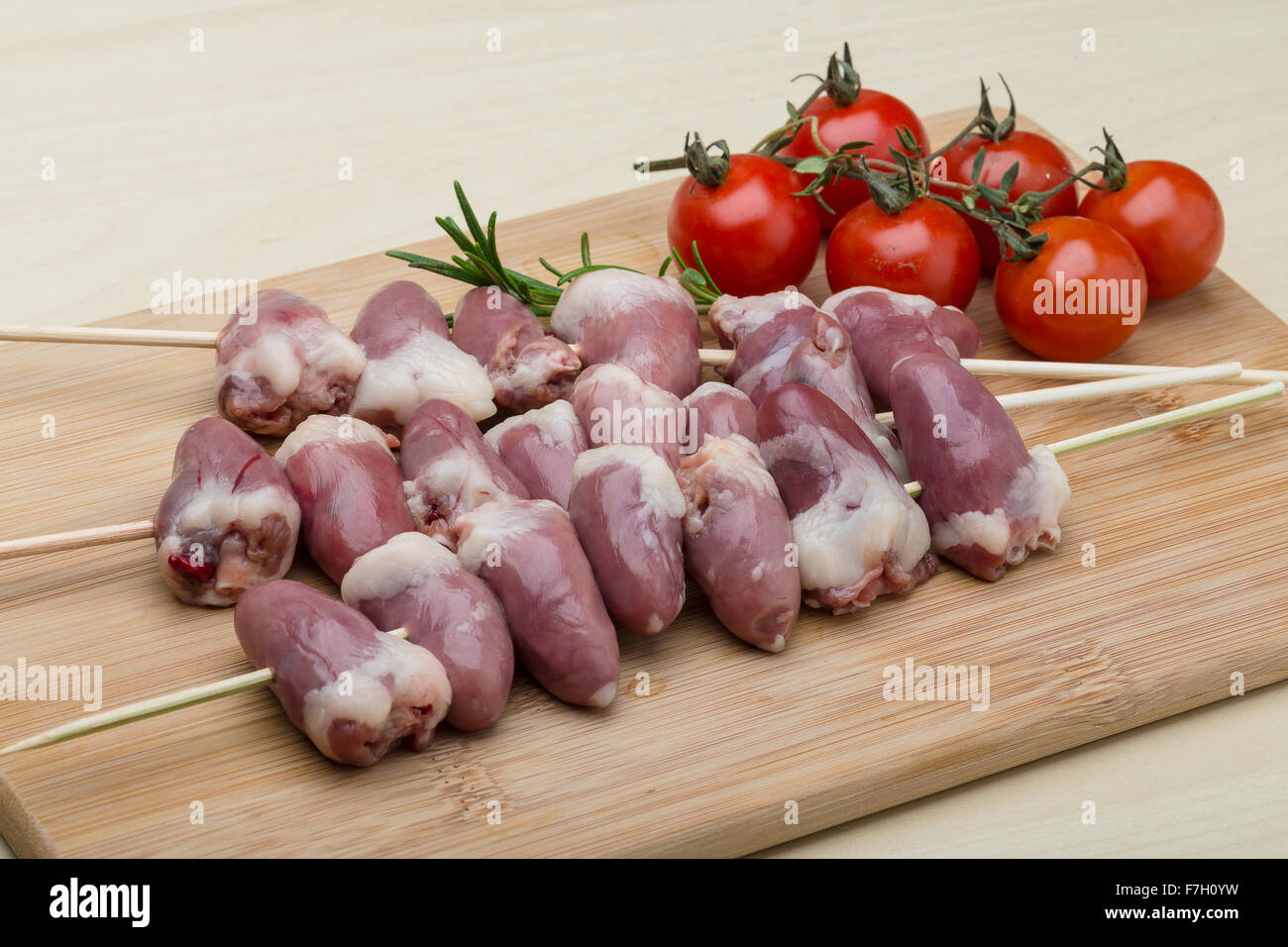 Raw chicken hearts ready for barbecue with rosemary Stock Photo - Alamy