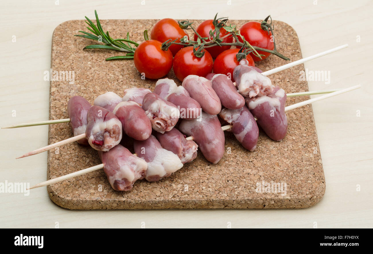 Raw chicken hearts ready for barbecue with rosemary Stock Photo - Alamy