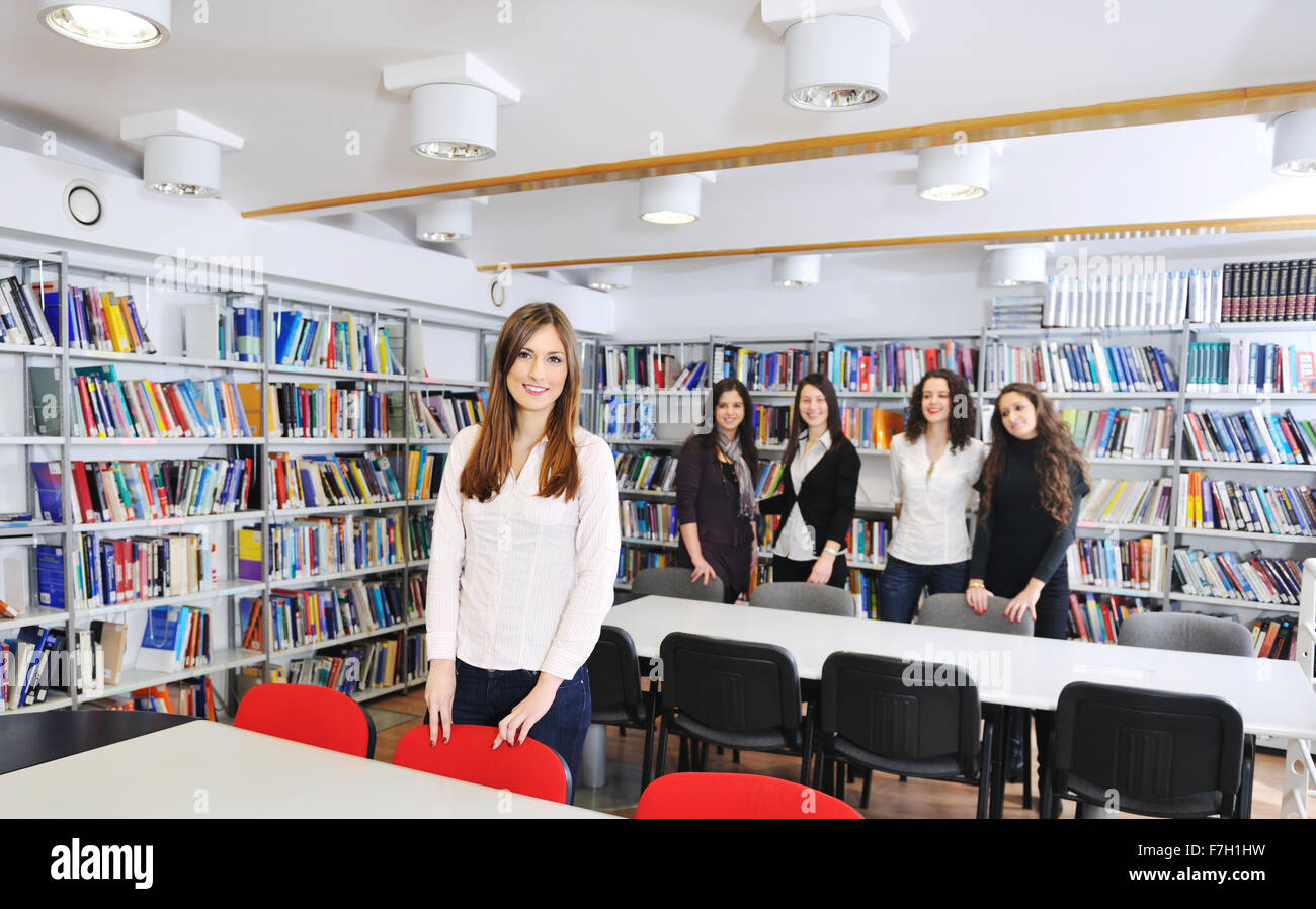 happy student woman group portrait at library Stock Photo - Alamy